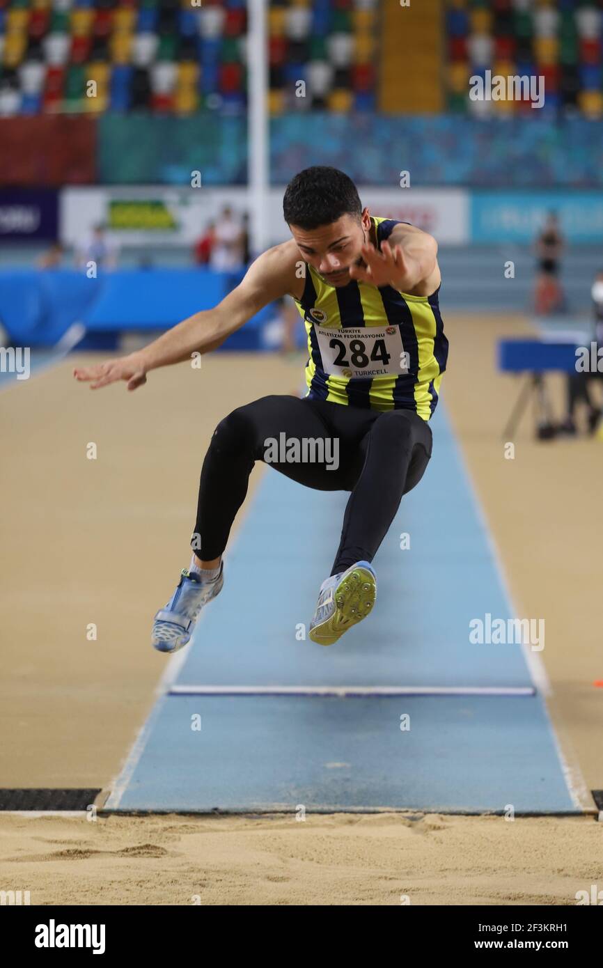 ISTANBUL, TURKEY - JANUARY 30, 2021: Undefined athlete long jumping ...