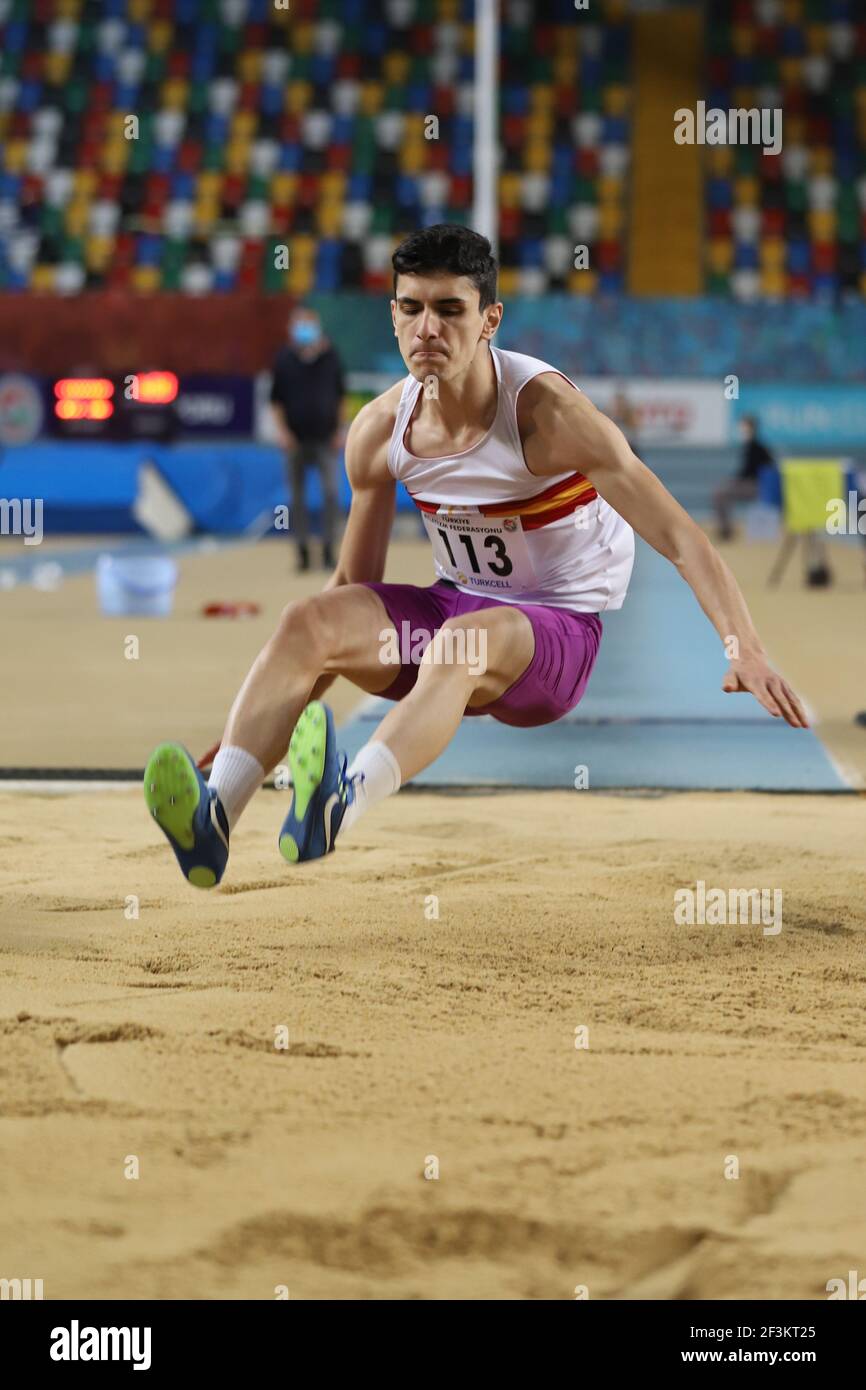 ISTANBUL, TURKEY - JANUARY 30, 2021: Undefined athlete long jumping ...