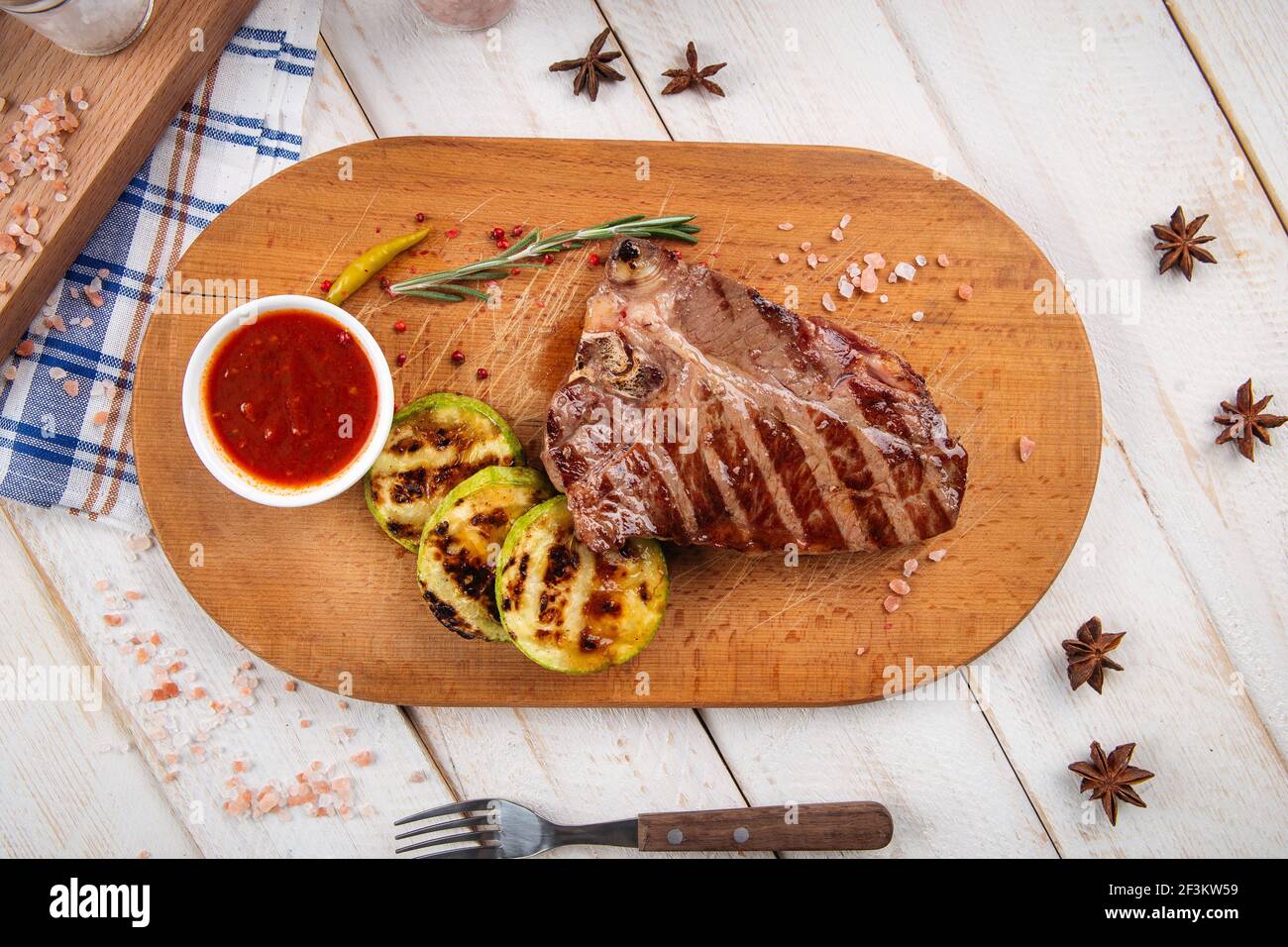 Grilled beef steak with squash slices and sauce Stock Photo - Alamy