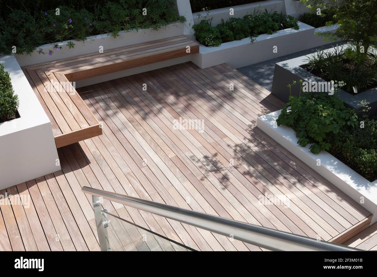 A series of rendered and painted retaining walls and raised beds ...