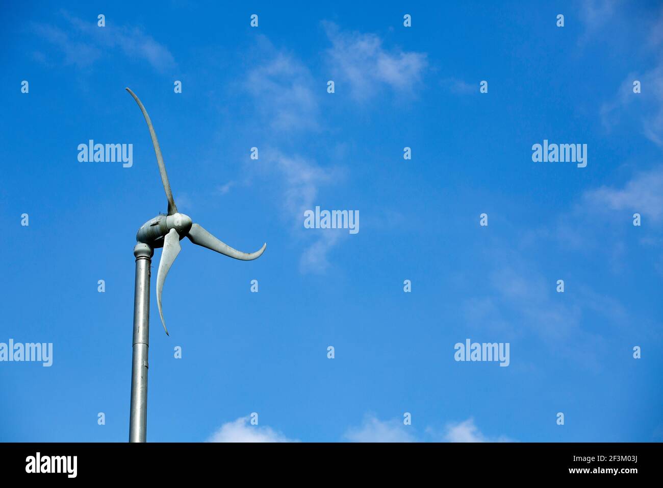 Renewable energy propeller with blue sky - Text space Stock Photo - Alamy
