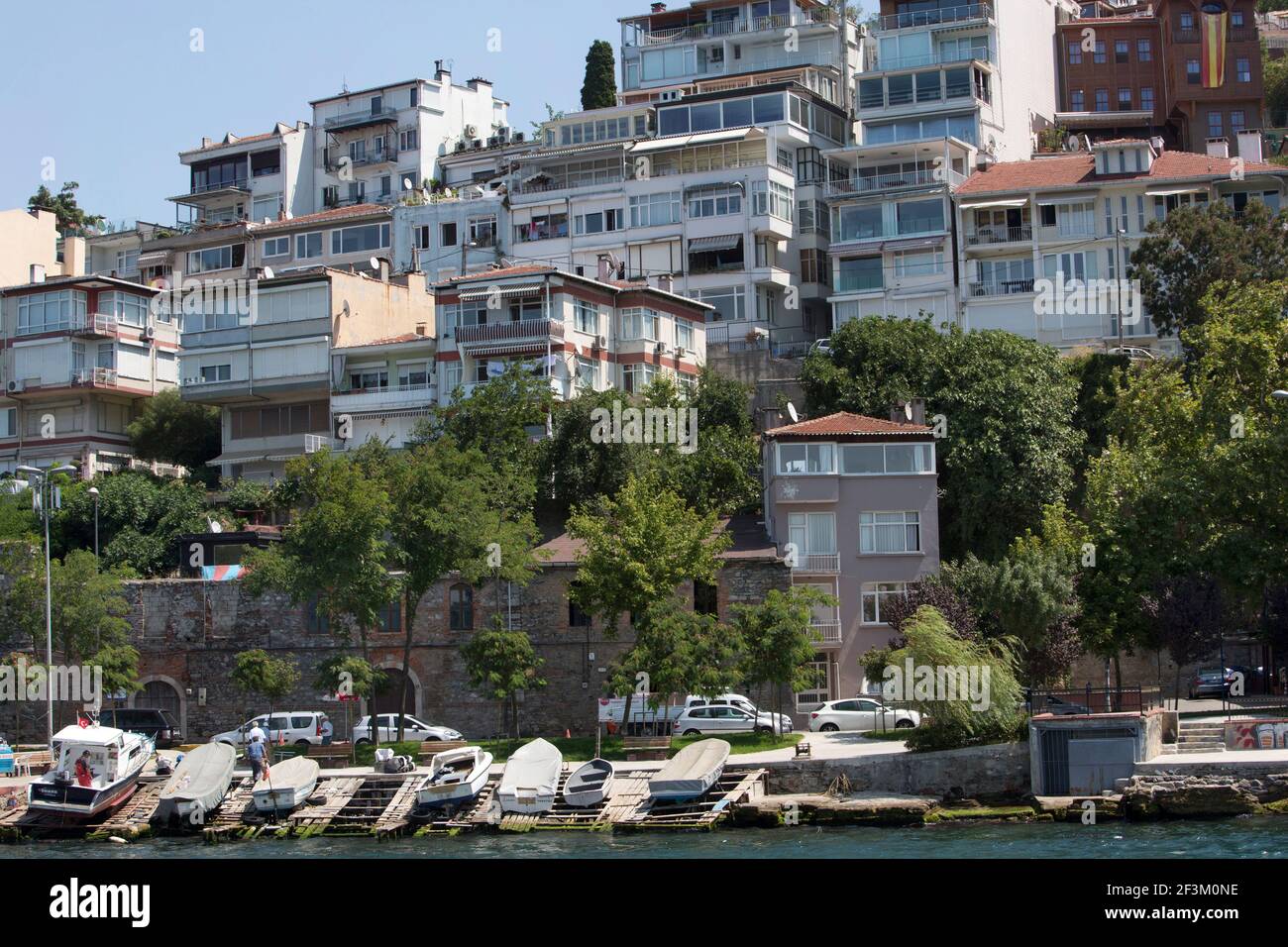 Houses and boats lines the cliffs of the Bosphorus river in Istanbul ...