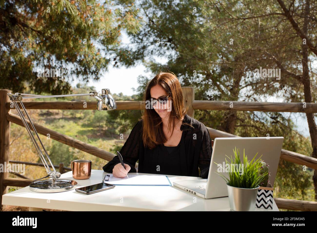 Freelance girls work typing on the phone looking at the screen with ...