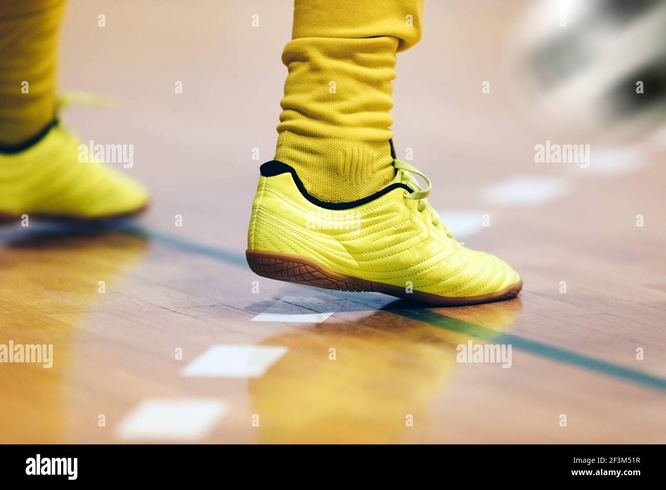 Indoor football player with classic ball. Futsal training for children ...
