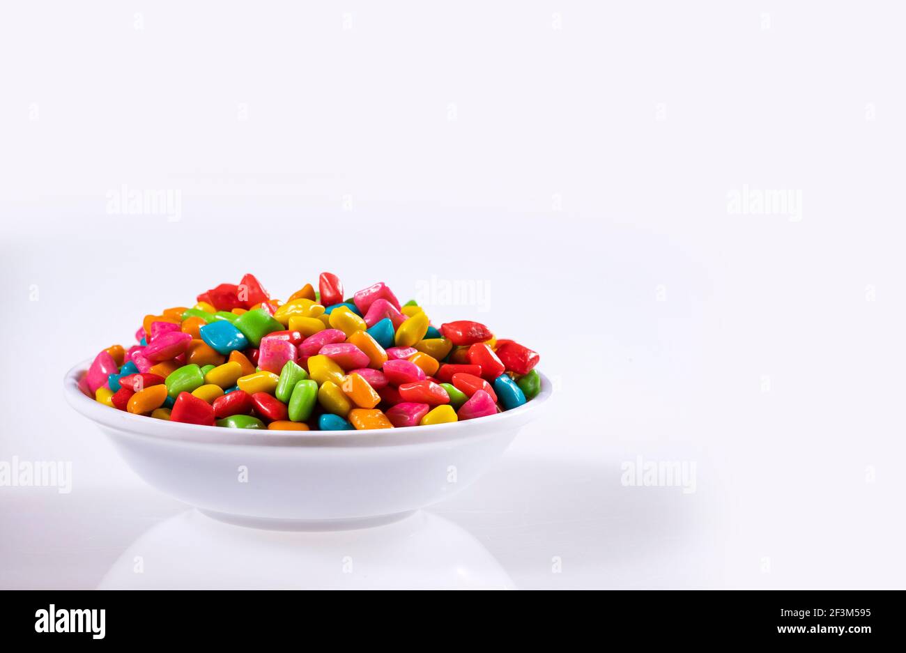 Colored chewing gum in glass bowls - White background Stock Photo - Alamy