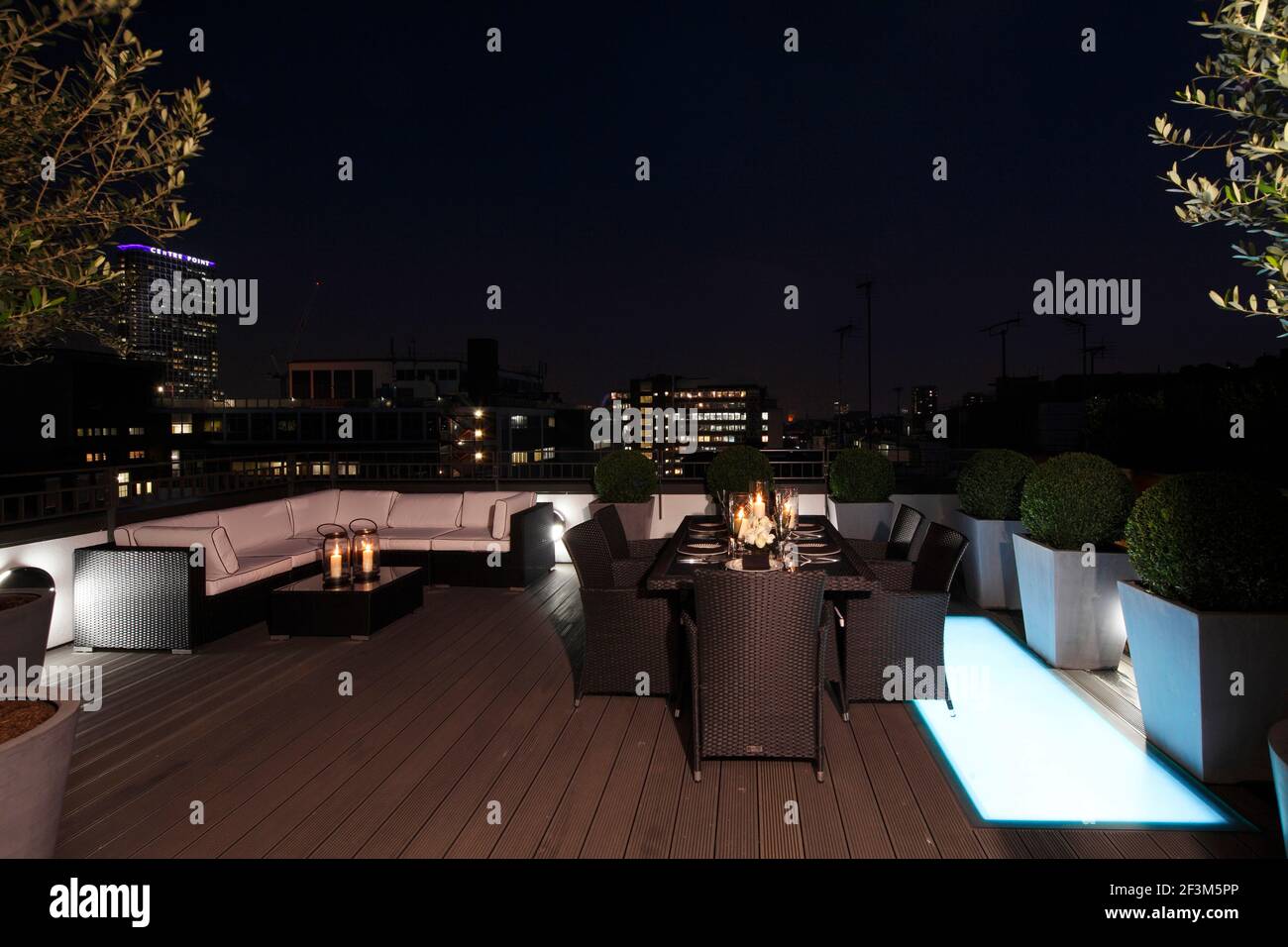 Roof terrace at night with Centre Point tower in the distance in UK ...