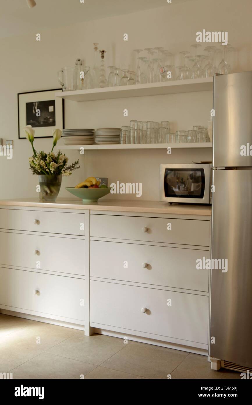 Sideboard in kitchen with shelves Stock Photo - Alamy