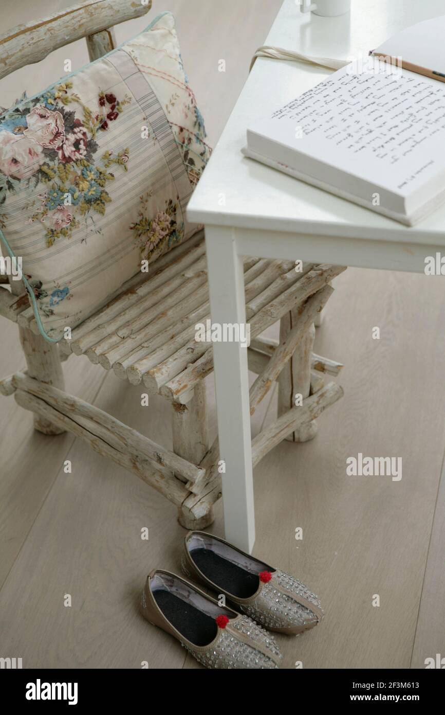 Child's writing desk with slippers Stock Photo - Alamy