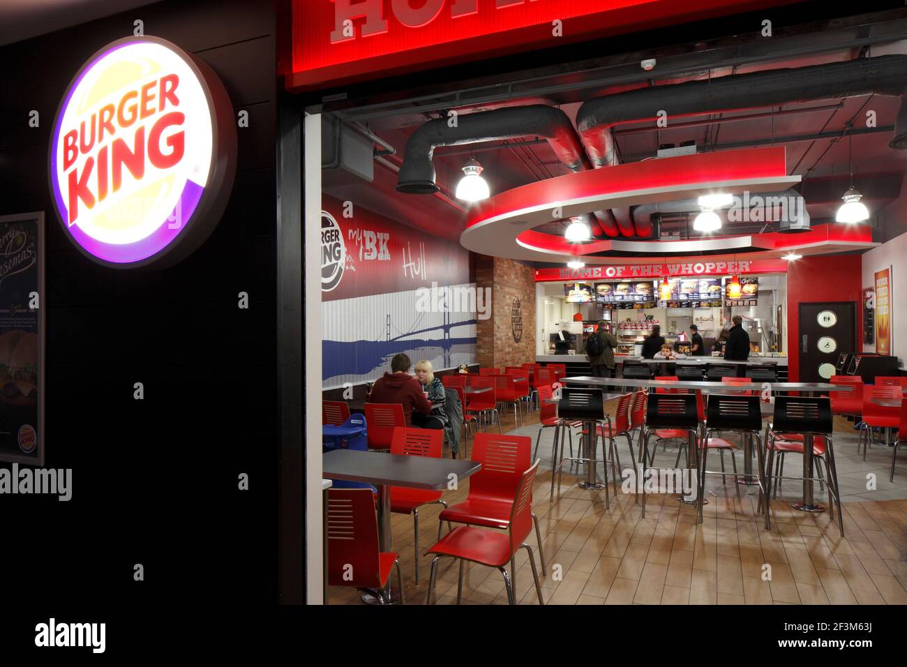 Looking into Burger King outlet from shopping mall with backlit logo ...