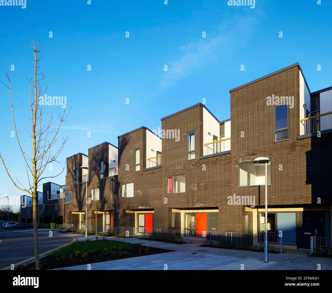 Front doors in development of houses, flats and a leisure centre by ...