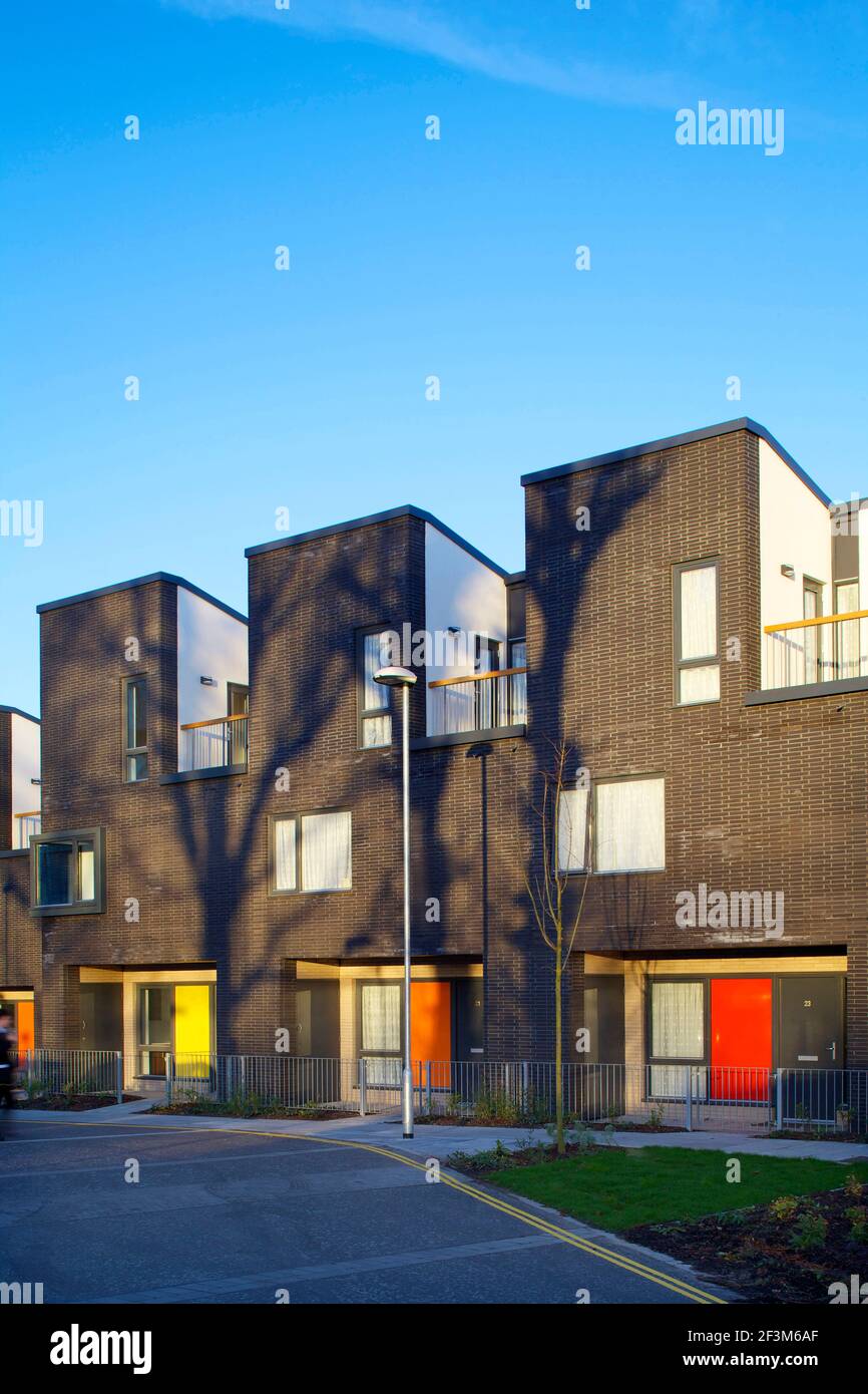Front doors in development of houses, flats and a leisure centre by ...