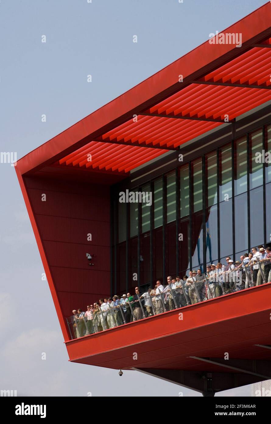 Spectators stand on balcony exterior of The Point, Lancashire County ...