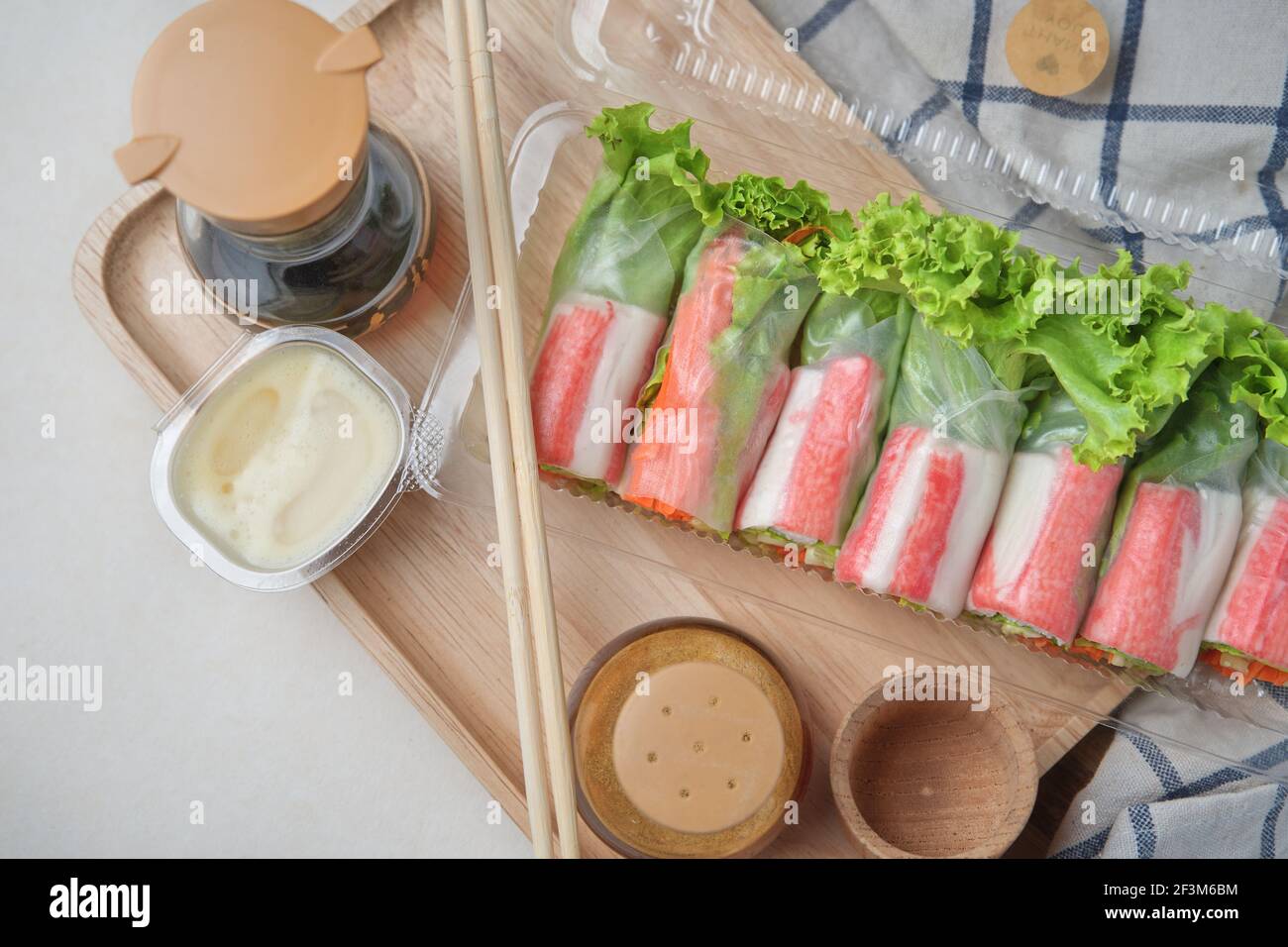 The fresh spring rolls in the plastic container Stock Photo - Alamy