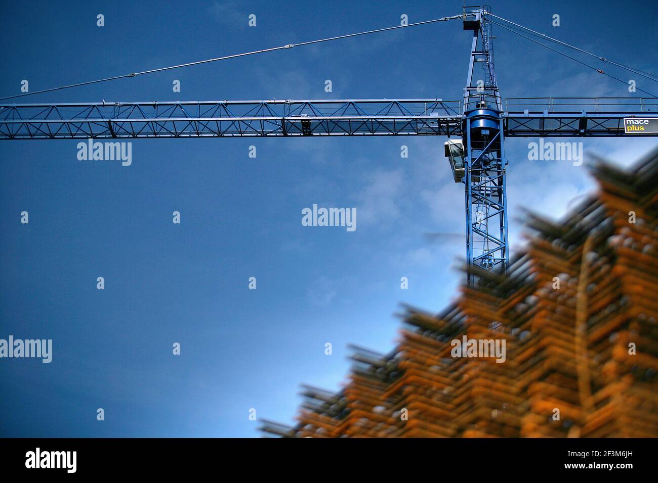 Low angle view of crane on construction site, UK Stock Photo - Alamy