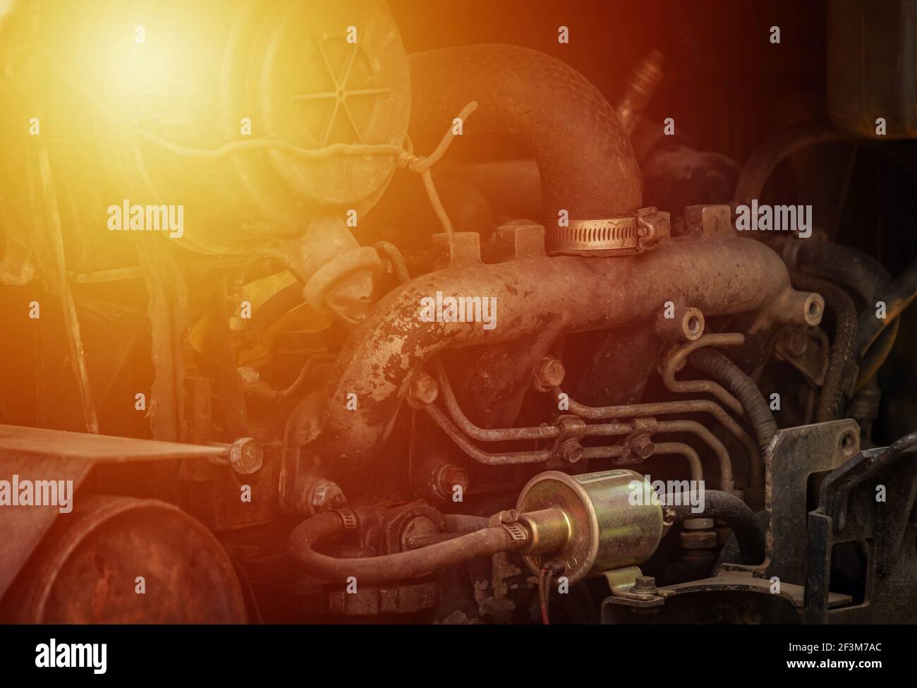 Close up pipes and old Loader car diesel engine. Car old engine part ...