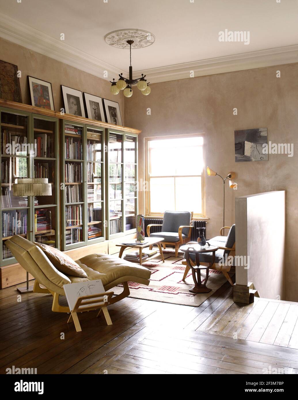 Open plan living room with bookshelves in residential home, UK Stock ...