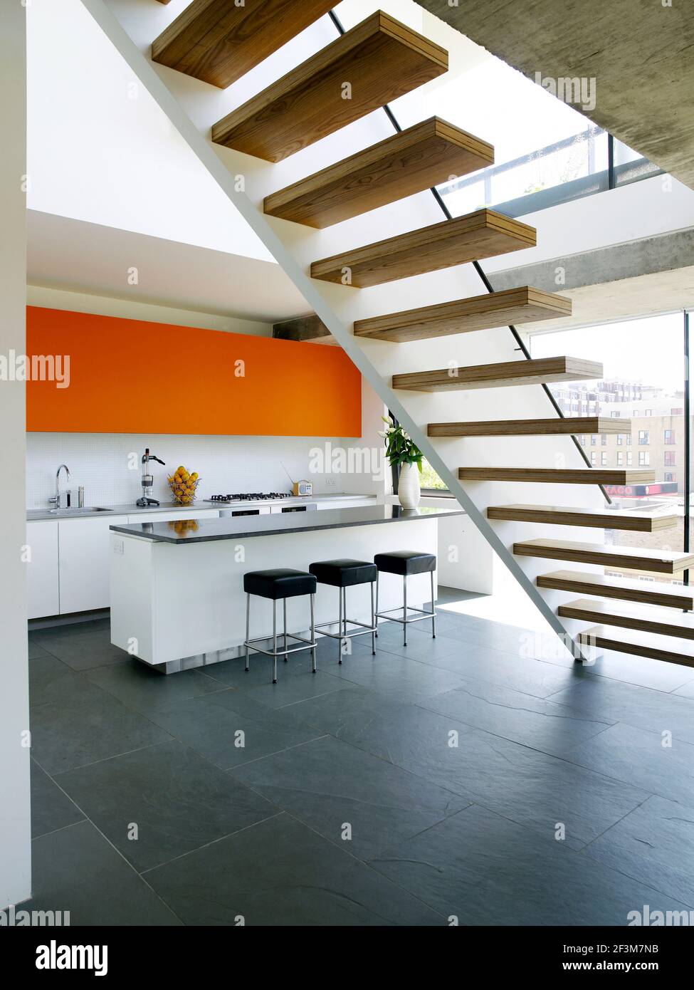Kitchen in large open plan room with stairs in Batemans Row home, UK ...