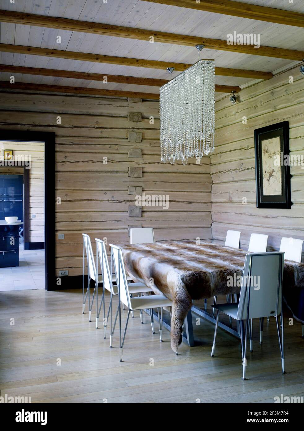 Wooden walls and dining table in modern Russian chalet Stock Photo - Alamy