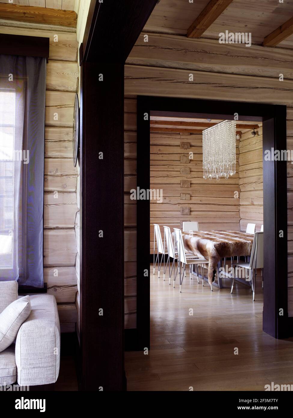 View through doorframe to dining room in modern Russian chalet Stock ...