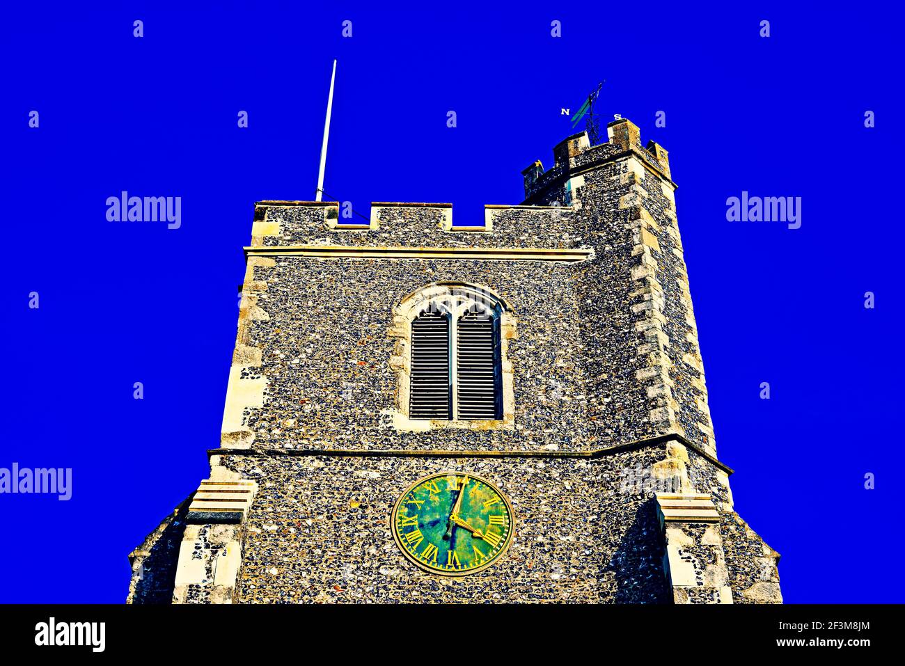 Church clock tower with blue sky background Stock Photo - Alamy