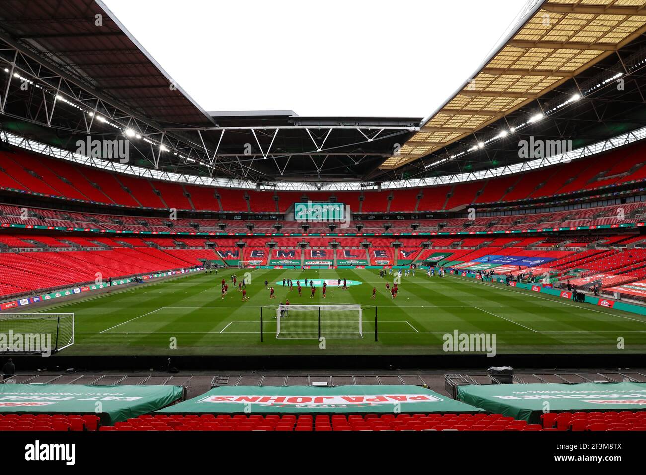 Players are seen warming up in a empty behind closed doors Wembley ...