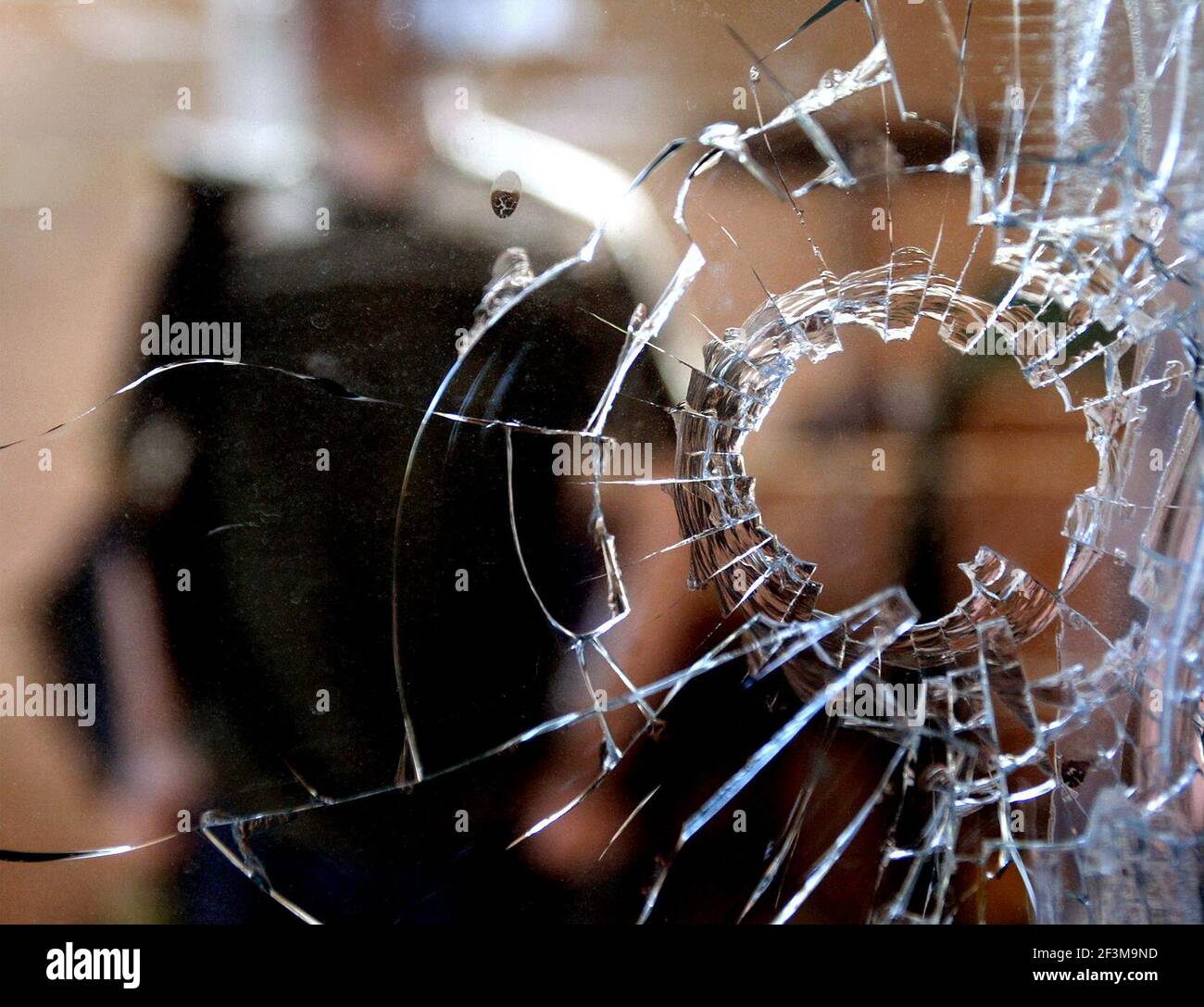 Bullet holes in a window Stock Photo - Alamy