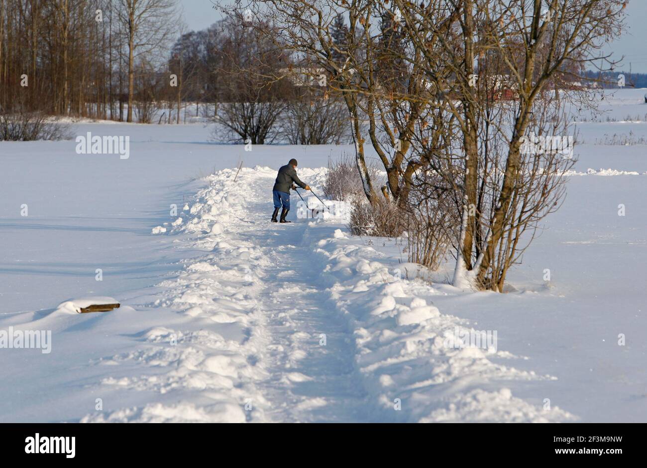Someone shoveling snow Stock Photo - Alamy