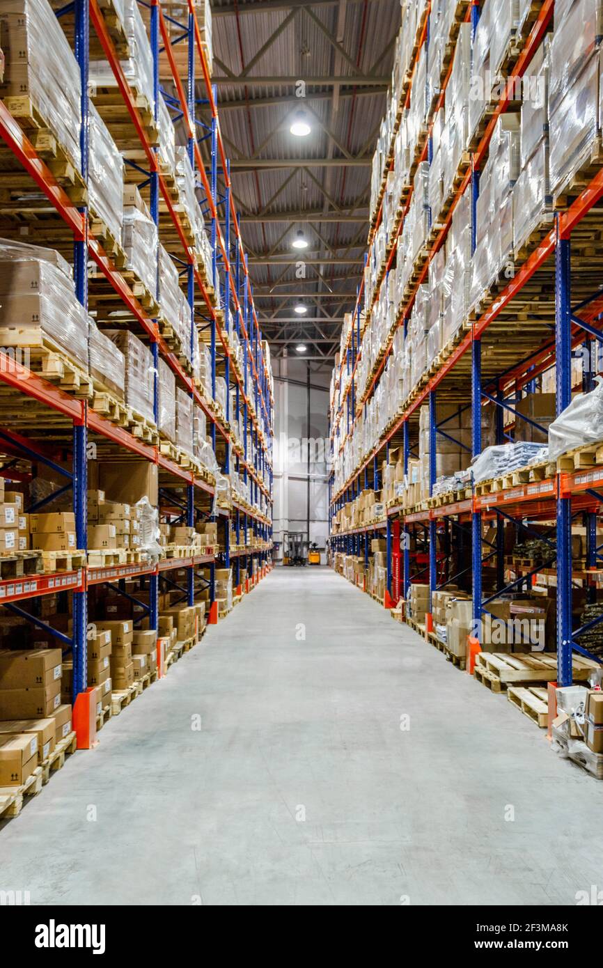 Interior of a modern warehouse storage of retail shop with pallet truck ...