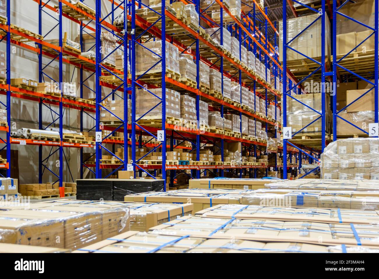 Interior of a modern warehouse storage of retail shop with pallet truck ...