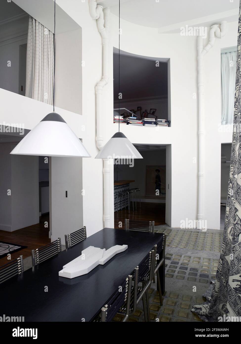 Open plan dining area with split level view to upper and lower rooms ...