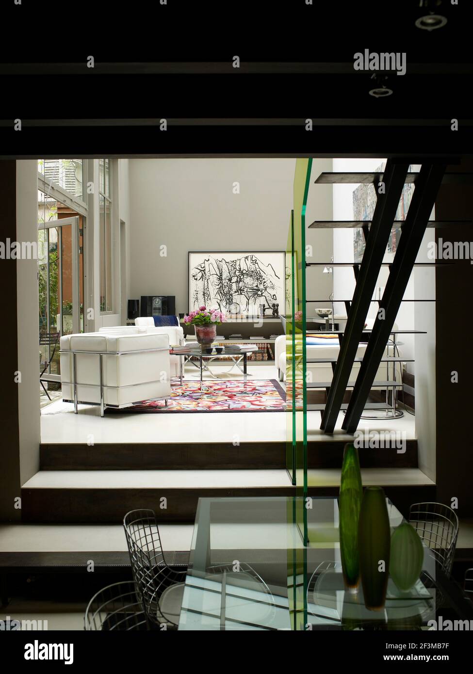 Split level open plan living and dining area with staircase in French ...