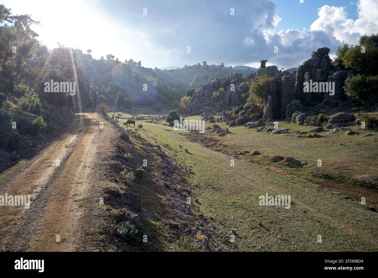 Countryside valley with rock formations in sunlight Stock Photo - Alamy