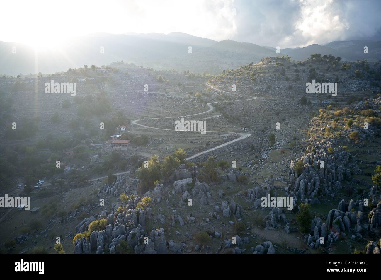 Aerial view of misty mountain valley with rock formations Stock Photo ...