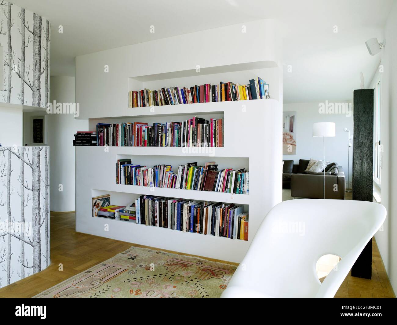 Large ceiling to floor bookcase in residential house, Switzerland Stock ...