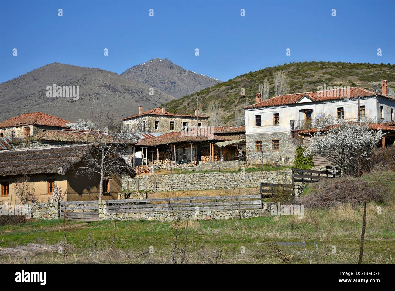 Landscape with traditional stone houses with clay tile rooftops in the ...