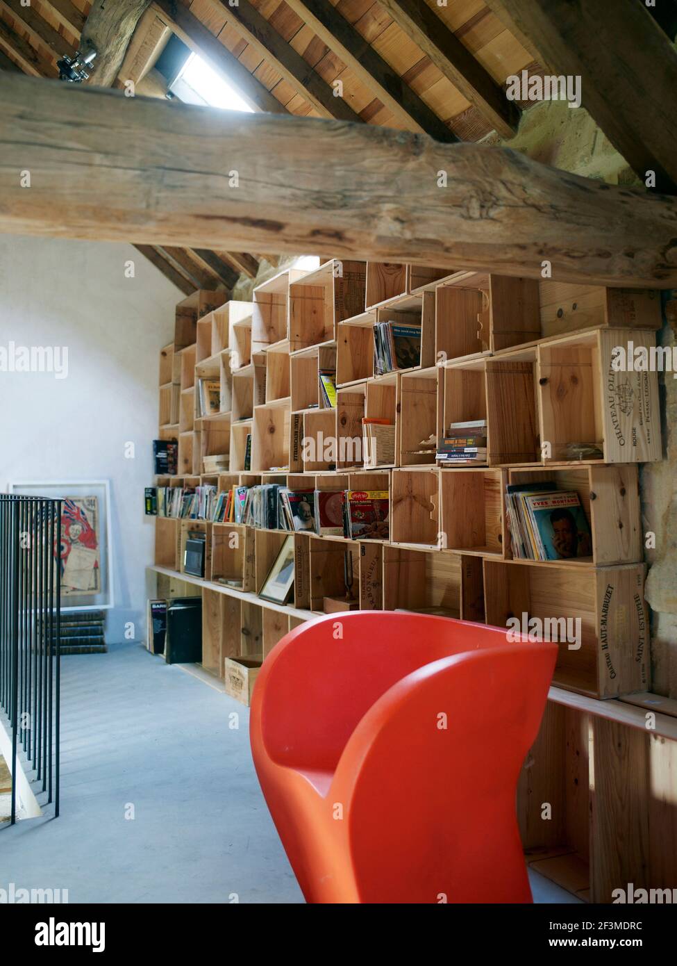 Stacked wooden wine crate storage in interior wooden beamed roof space ...