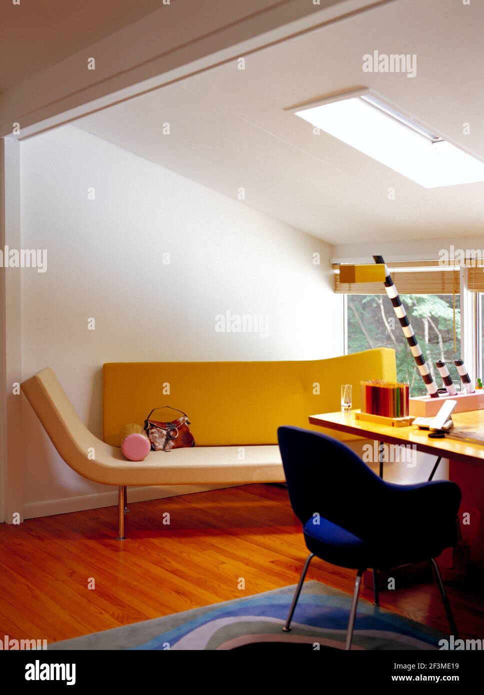 Recliner and desk under skylight in home, USA office of modern interior ...