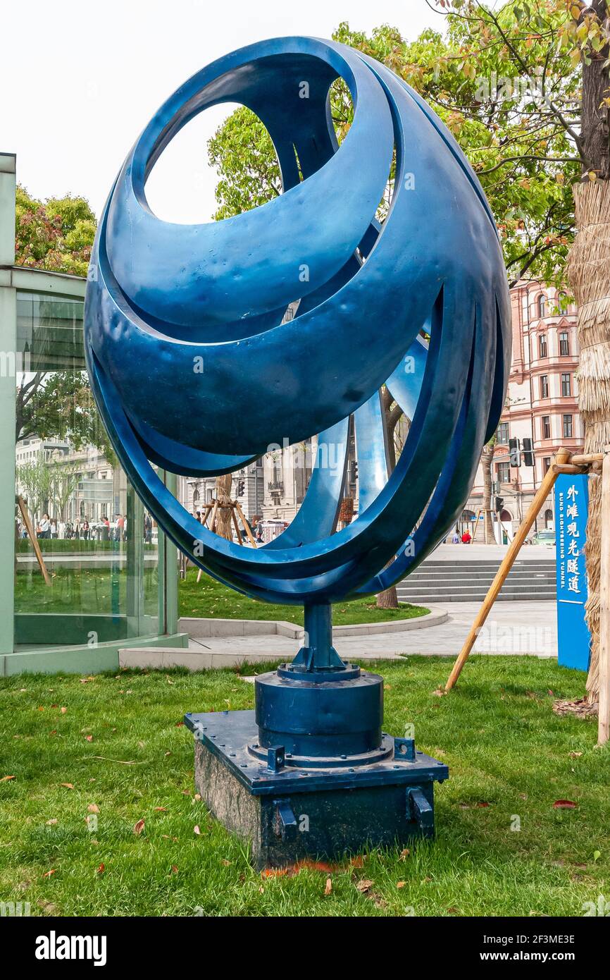 Shanghai, China - May 4, 2010: Closeup of blue sphere statue set in ...