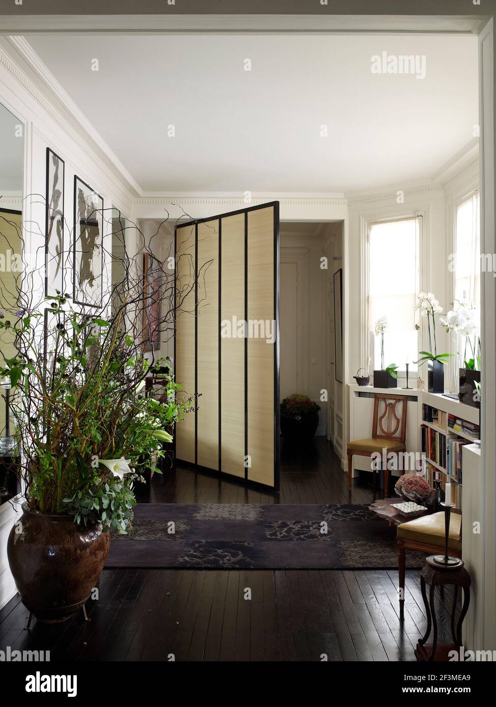 View through to shoji screen in hallway with wooden floor boards, bay ...