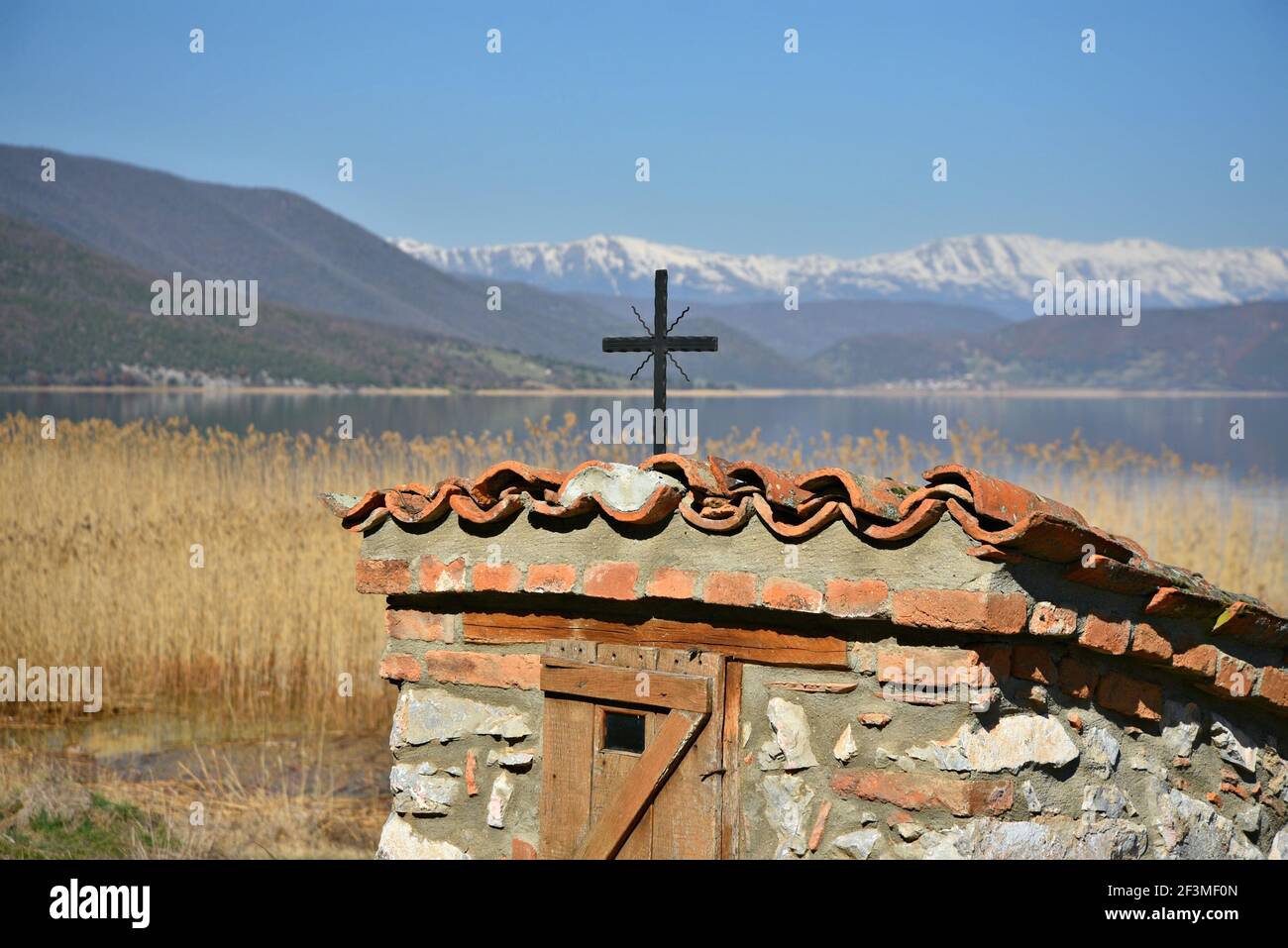 Landscape with scenic view of a stone built roadside memorial at Lesser ...