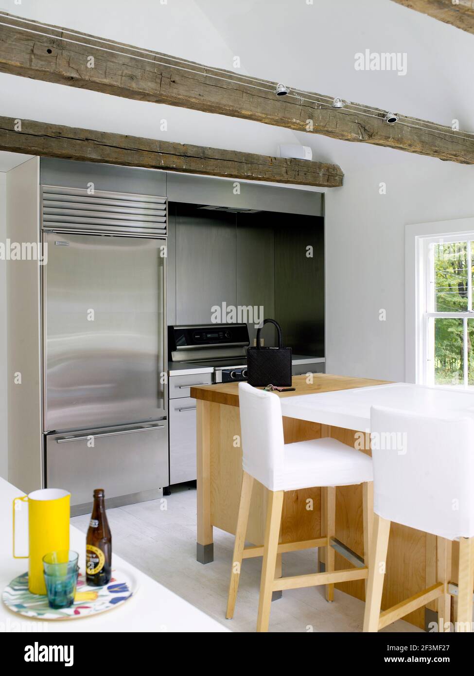 Breakfast bar in kitchen with wooden beams in Larson, New York, USA ...