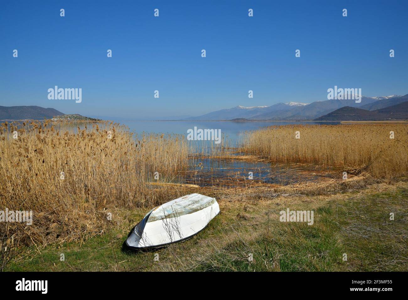 Landscape with scenic view of a traditional Greek fishing boat on the ...