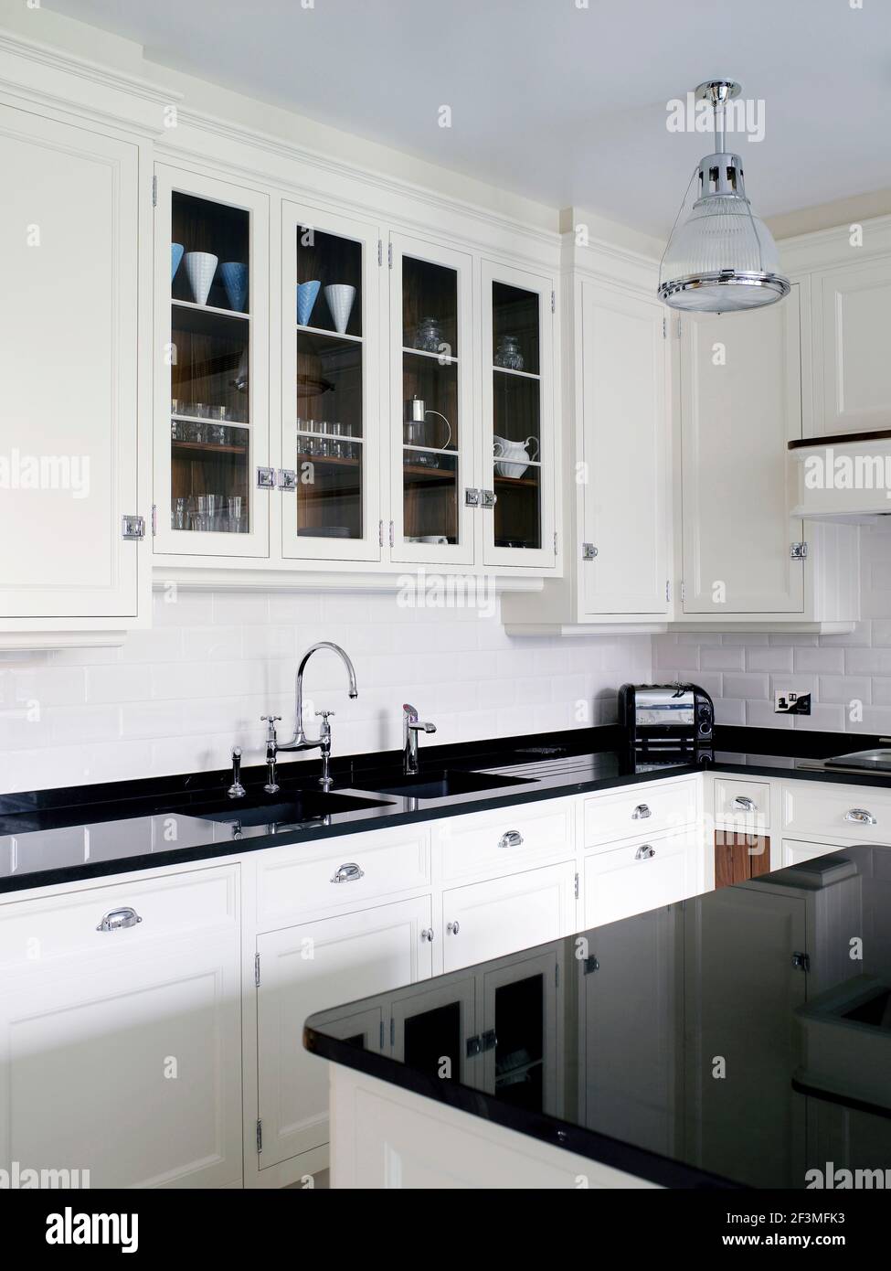 White and black kitchen in residential house, UK Stock Photo - Alamy