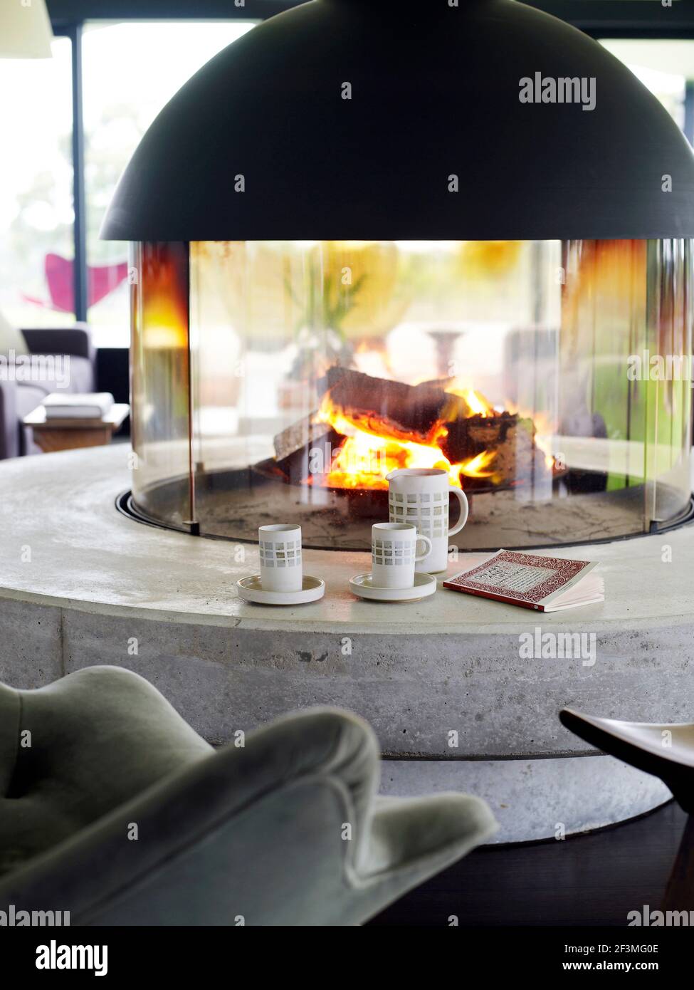 Circular fire with glass fireguard residential home, Australia Stock ...