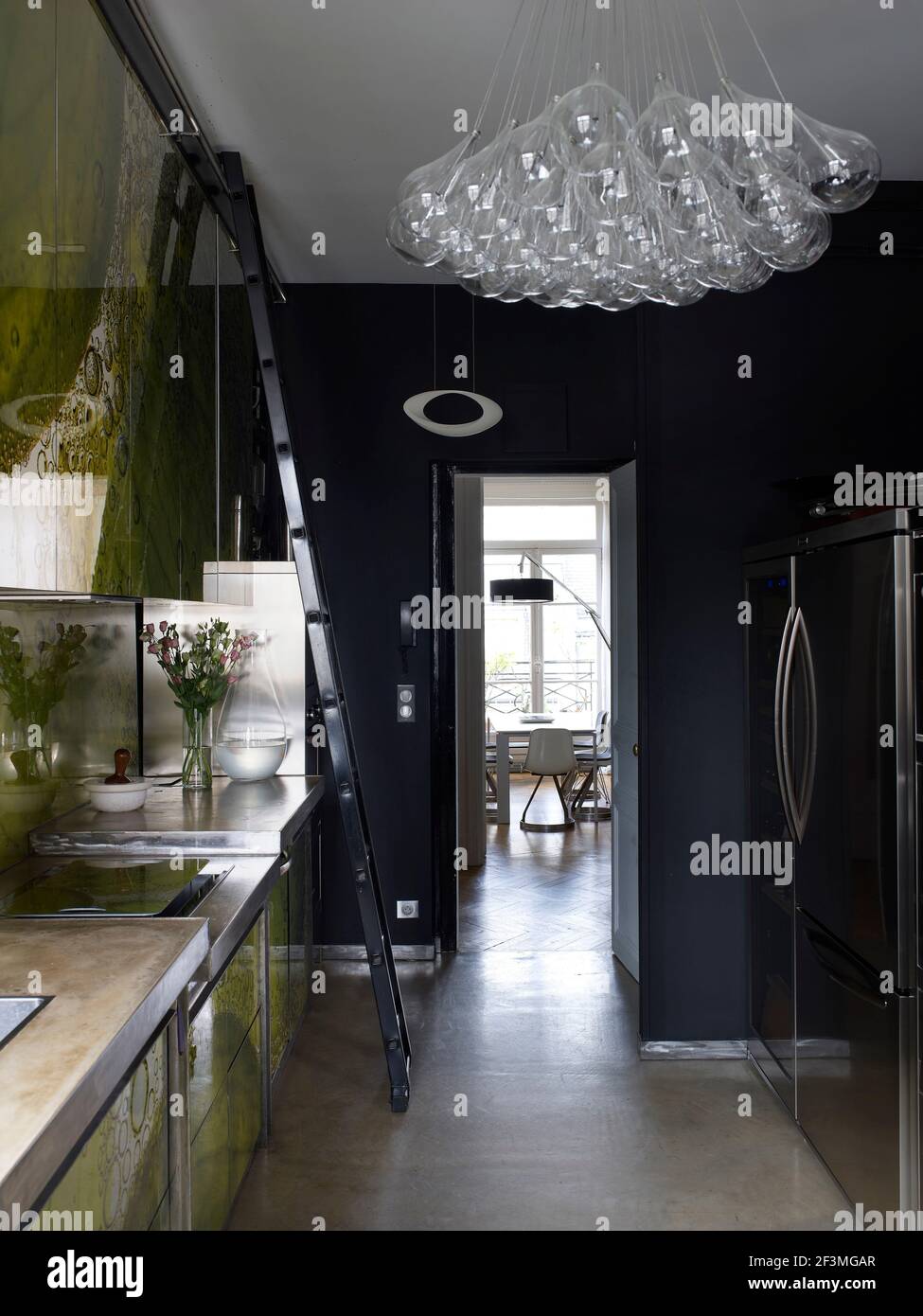 Ladder in kitchen with designer lighting, French apartment Stock Photo ...