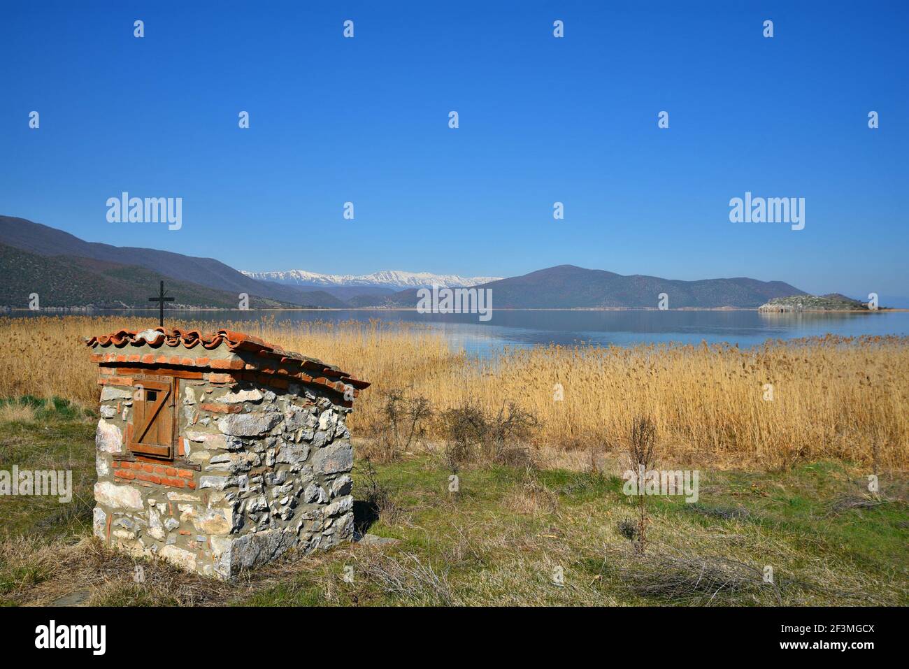 Landscape with scenic view of a stone built roadside memorial at Lesser ...