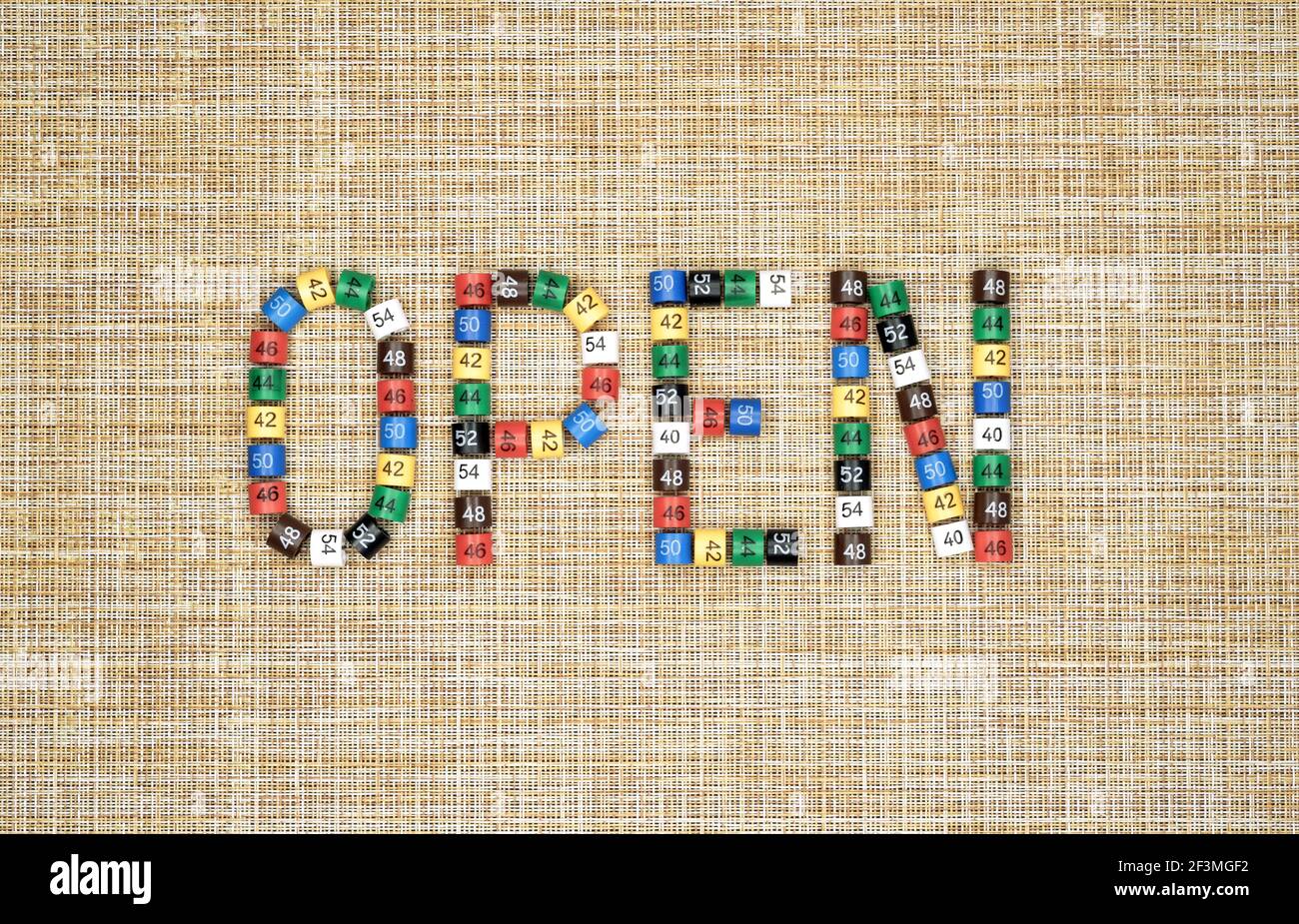 OPEN inscription made of many multicolored plastic size labels. Concept ...