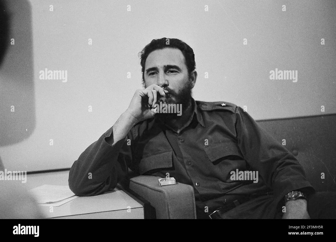 Fidel Castro in room at the Habana Libre Hotel, smoking cigar, Havana ...