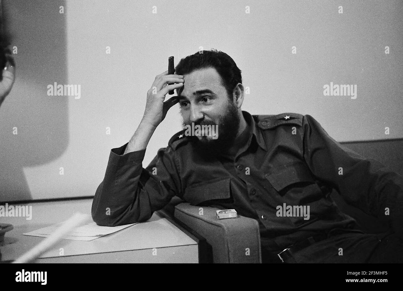 Fidel Castro in room at the Habana Libre Hotel, smoking cigar, Havana ...