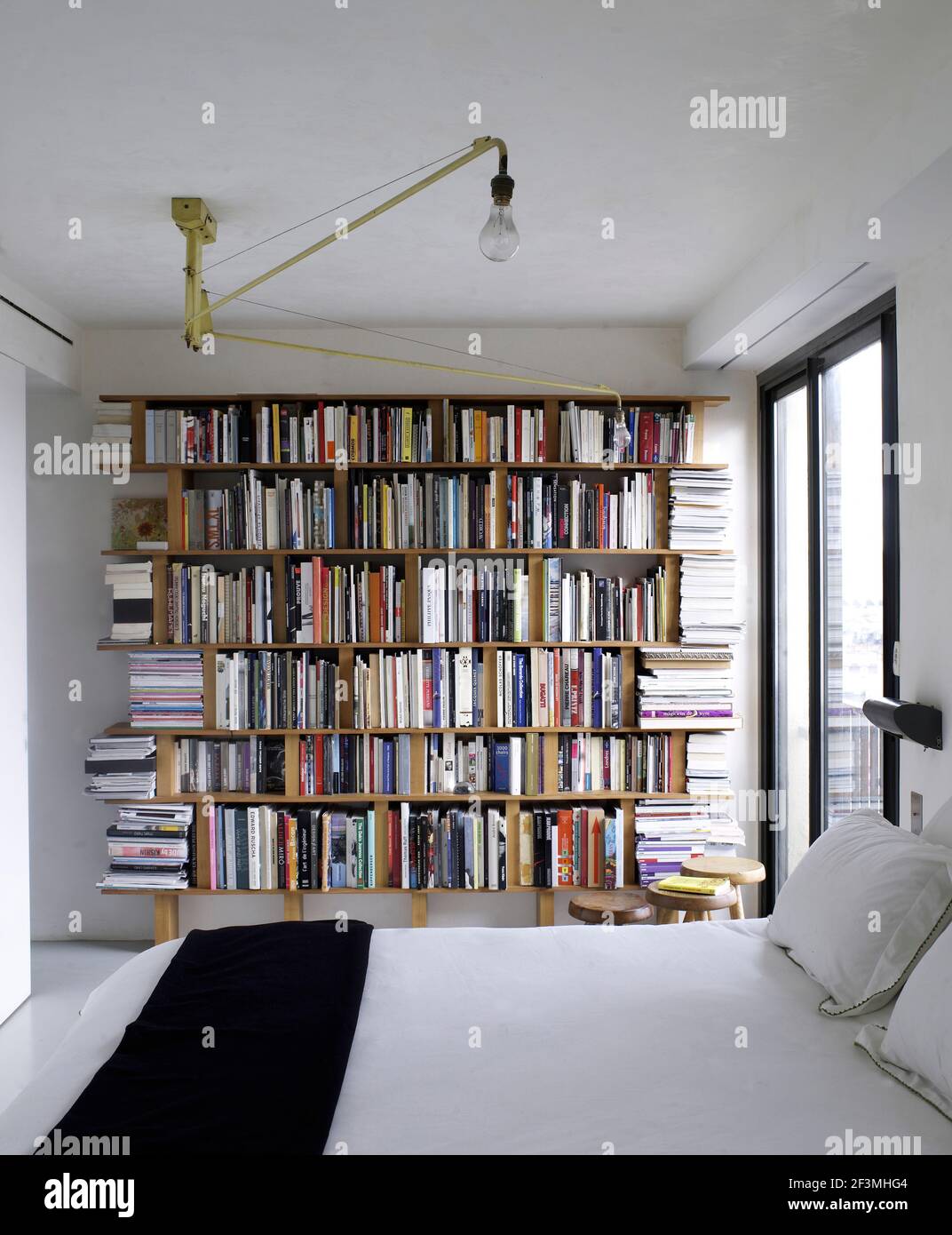 Bedroom bookcase in Paris home, France Stock Photo - Alamy